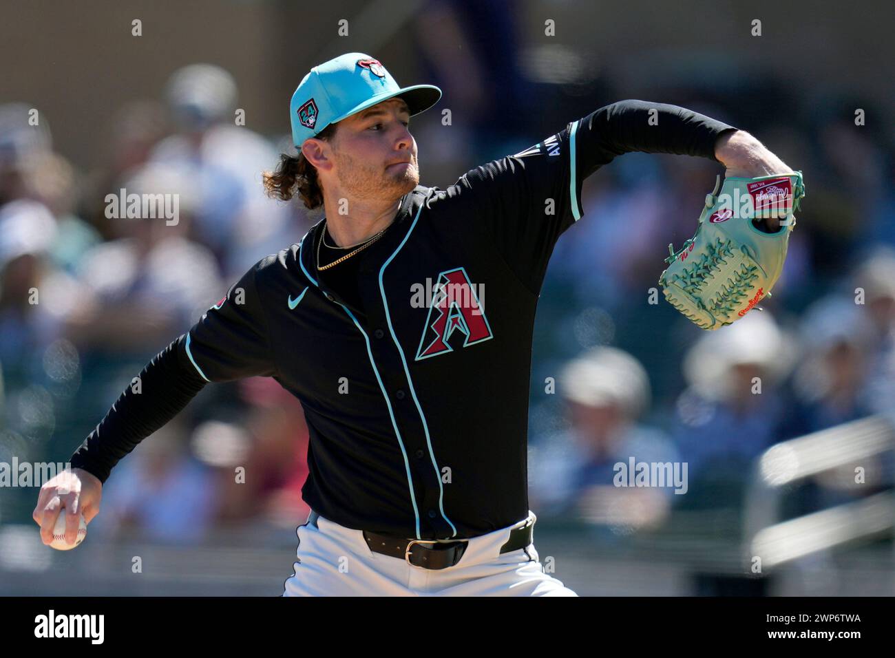 Arizona Diamondbacks starting pitcher Ryne Nelson warms up prior to a spring training baseball ...