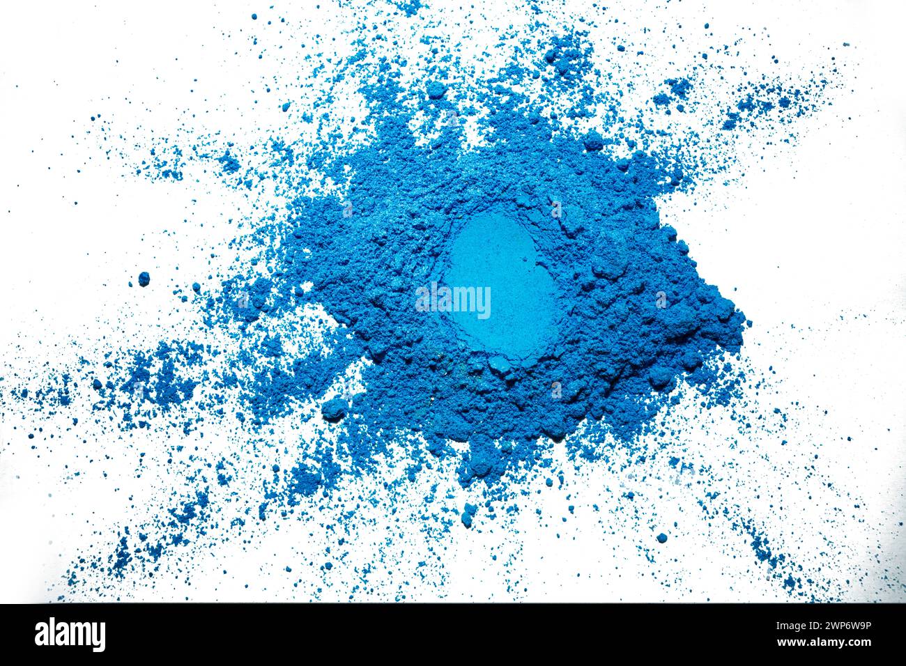Closeup view of blue Holi powder isolated over a white background. Holi ...