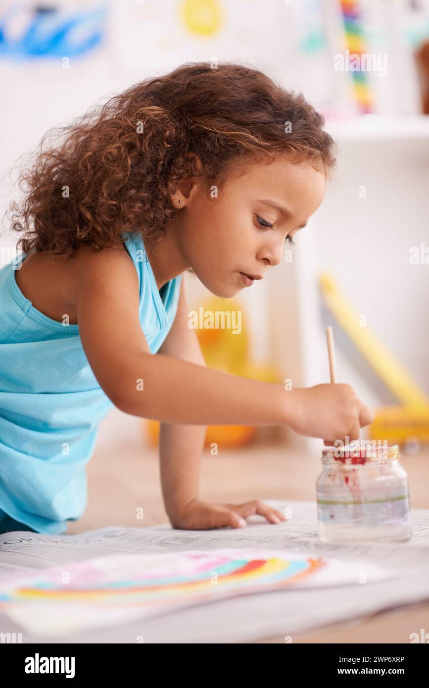 School girl painting rainbow on hi-res stock photography and images - Alamy