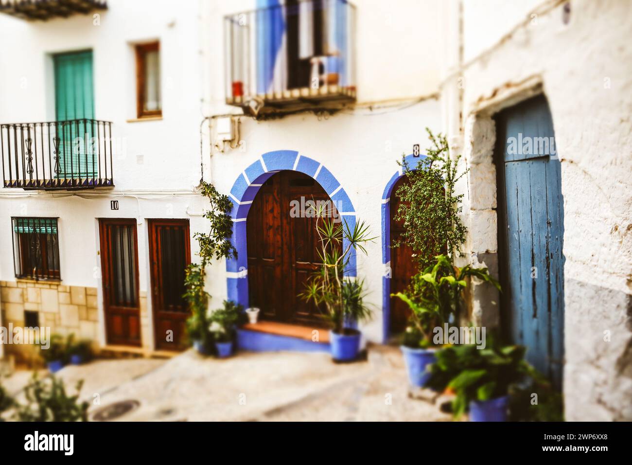 Medieval building, stone white house with blue door. Ancient ...
