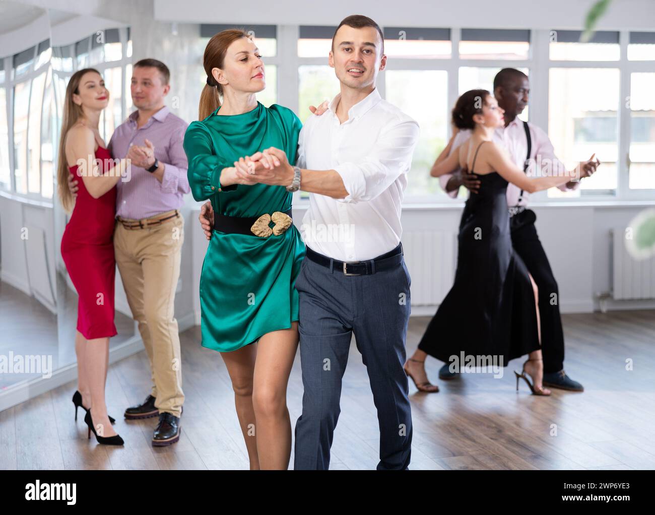 Man and woman dancing waltz in couple during lesson at studio Stock ...