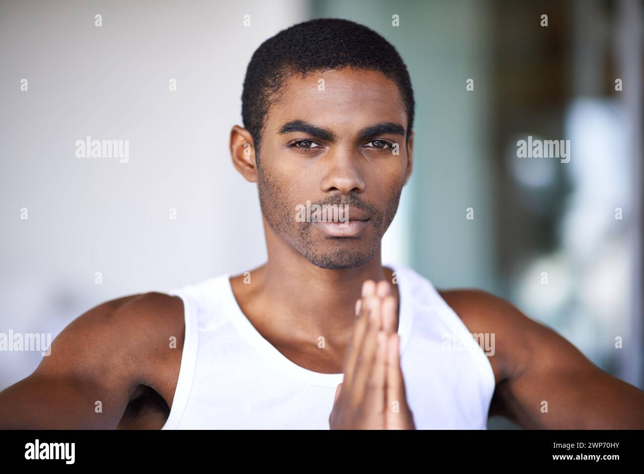 Hopeful young man praying home hi-res stock photography and images - Alamy