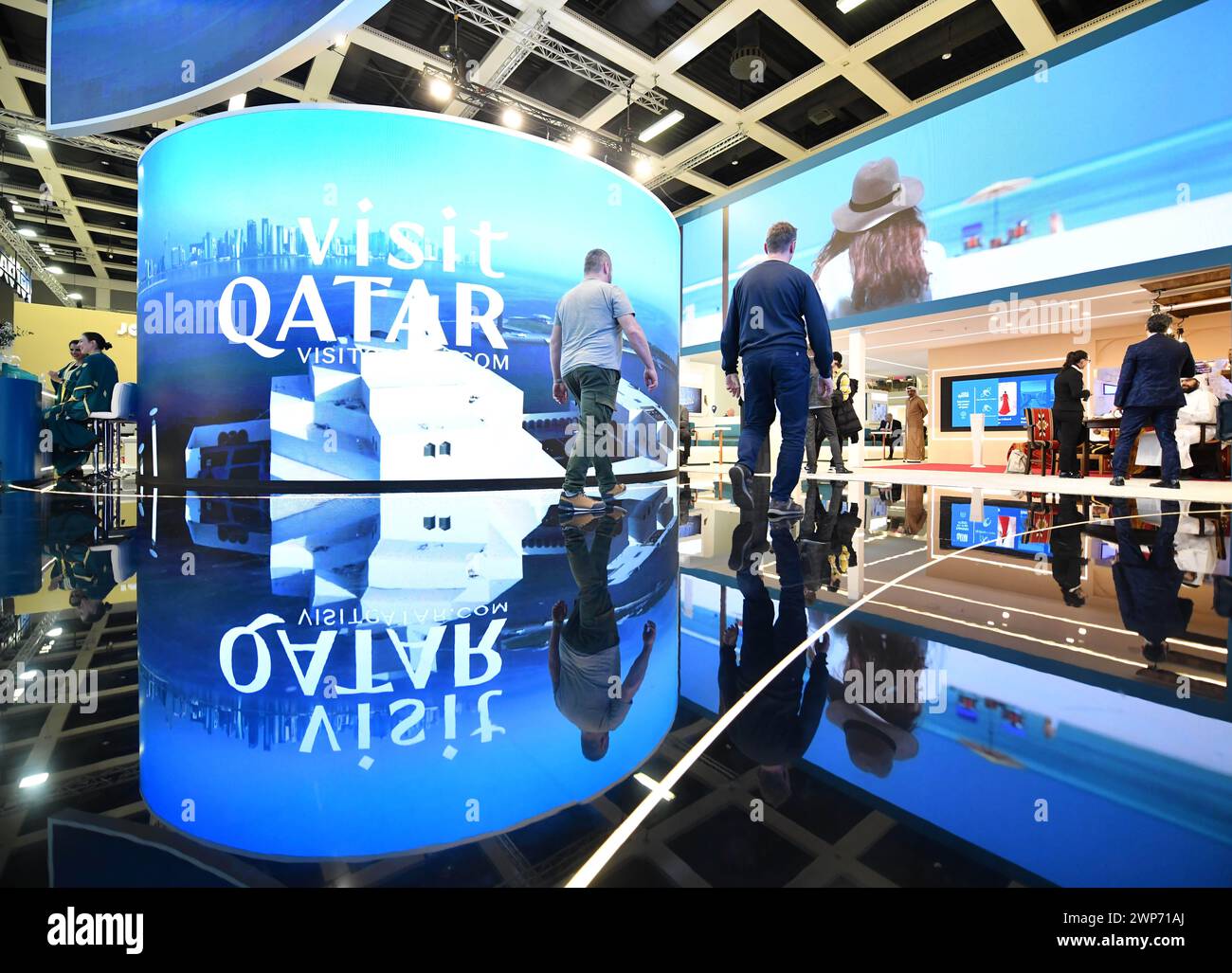 Berlin, Germany. 5th Mar, 2024. People walk past the booth of Qatar during the ITB Berlin travel ...