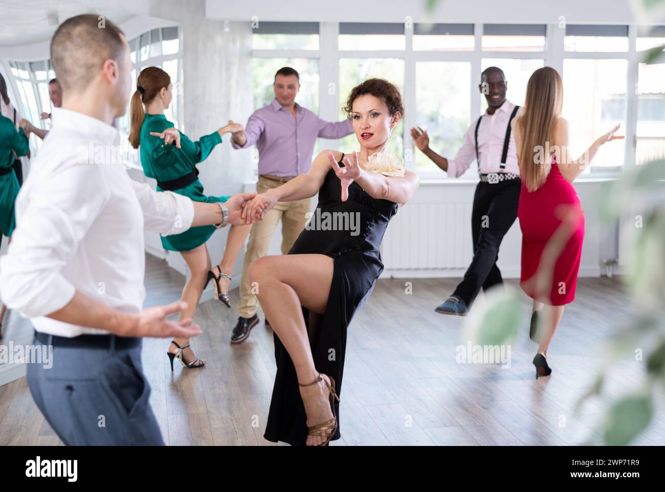 Woman dances incendiary boogie woogie with man partner during ...