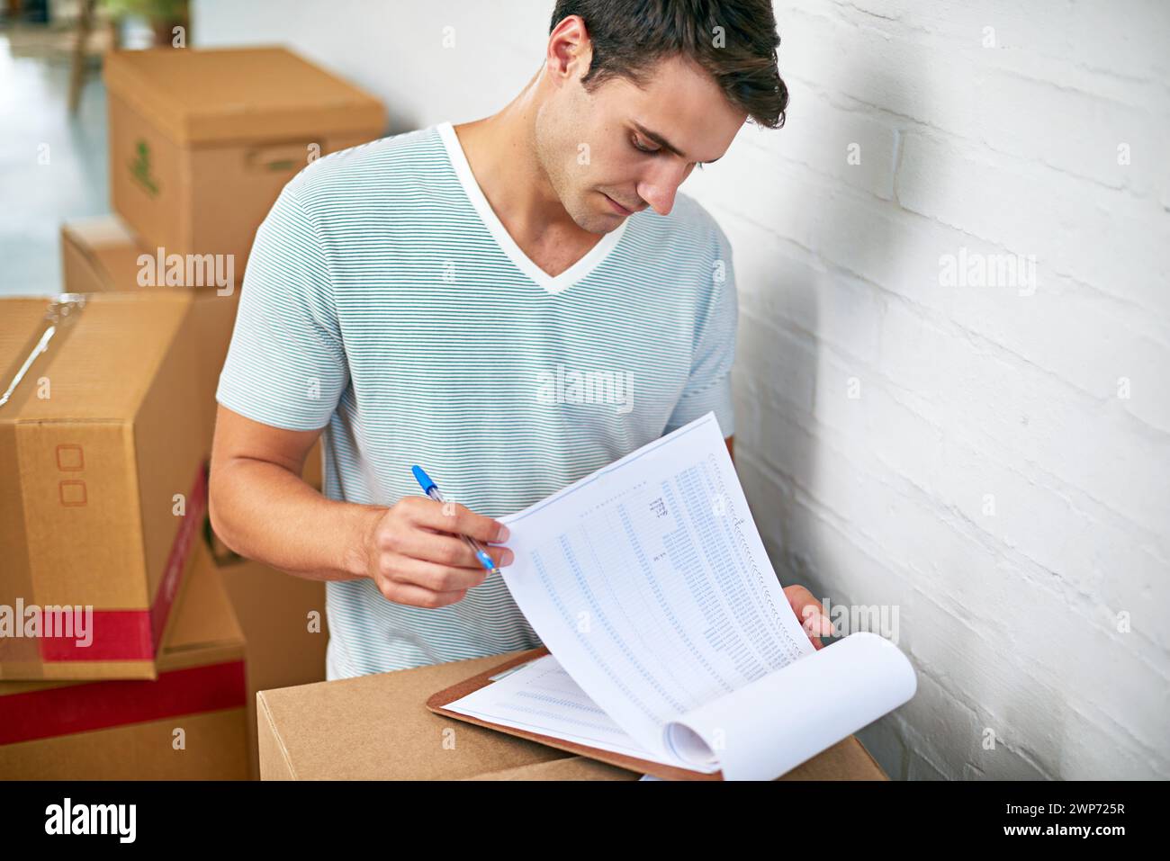 Man, boxes and home with clipboard for moving, delivery and ...