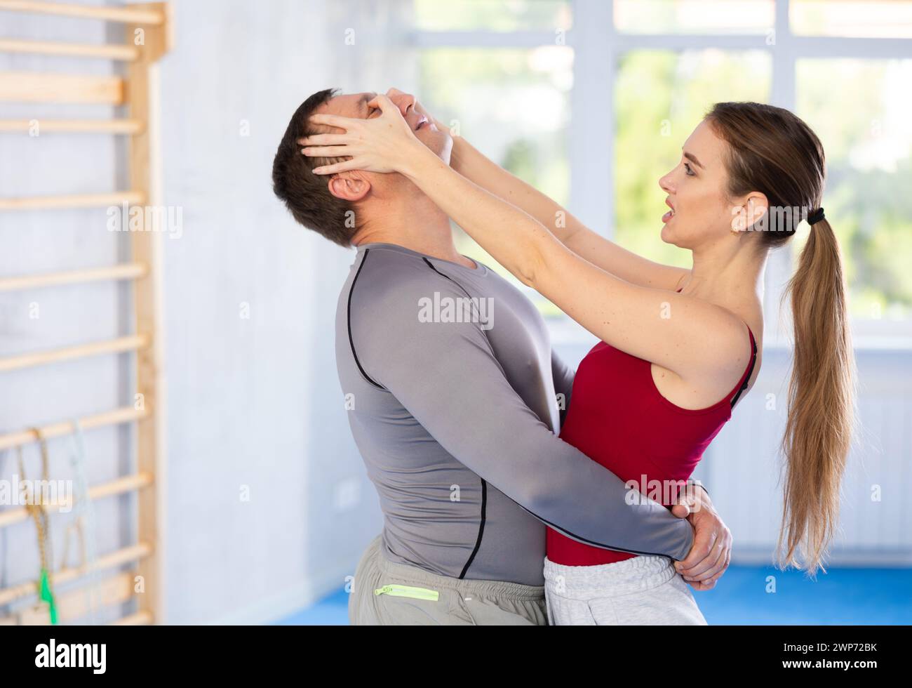 Woman and man practicing self defense techniques Stock Photo - Alamy