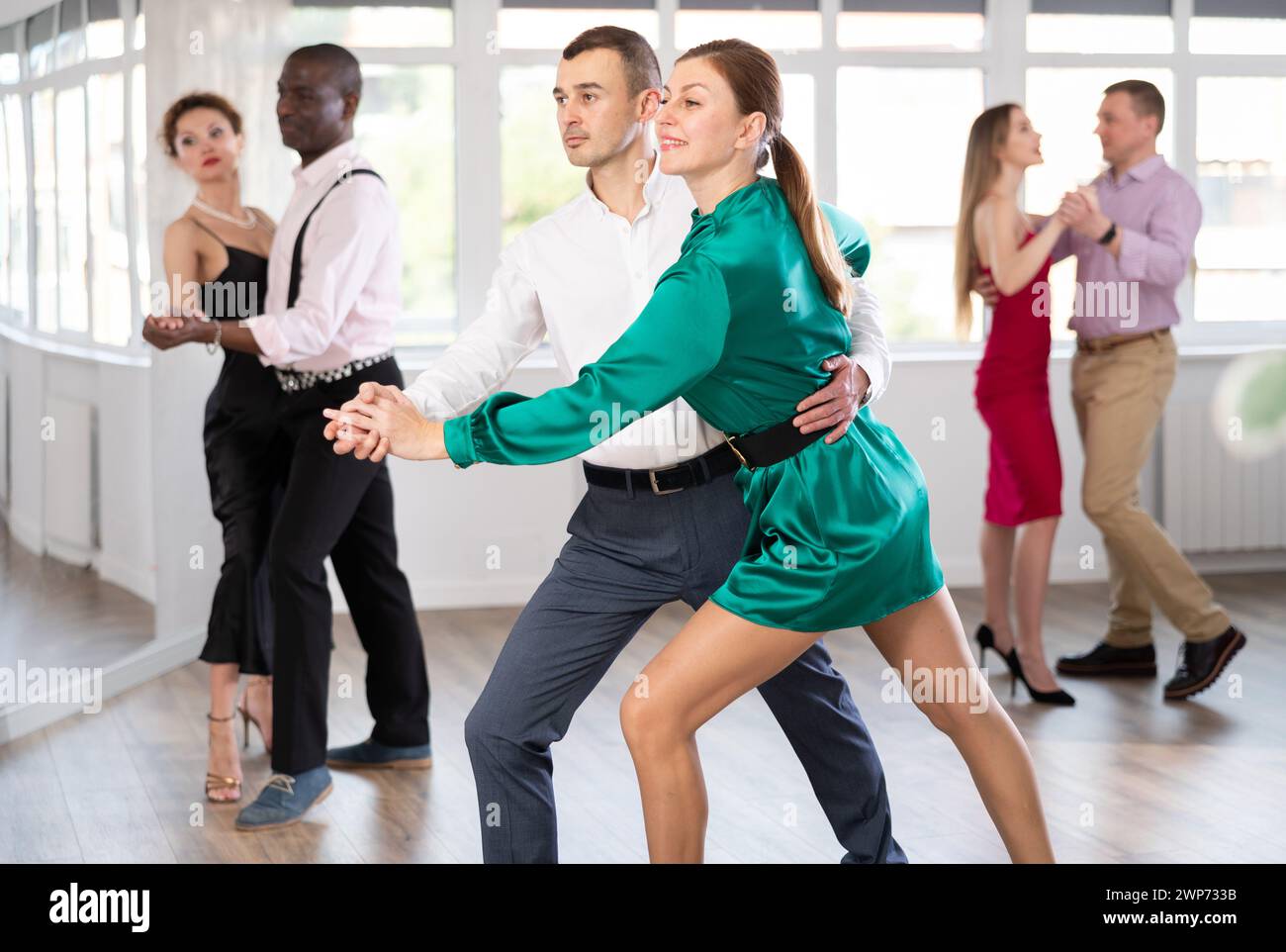 Man and woman dancing waltz in couple during lesson at studio Stock ...
