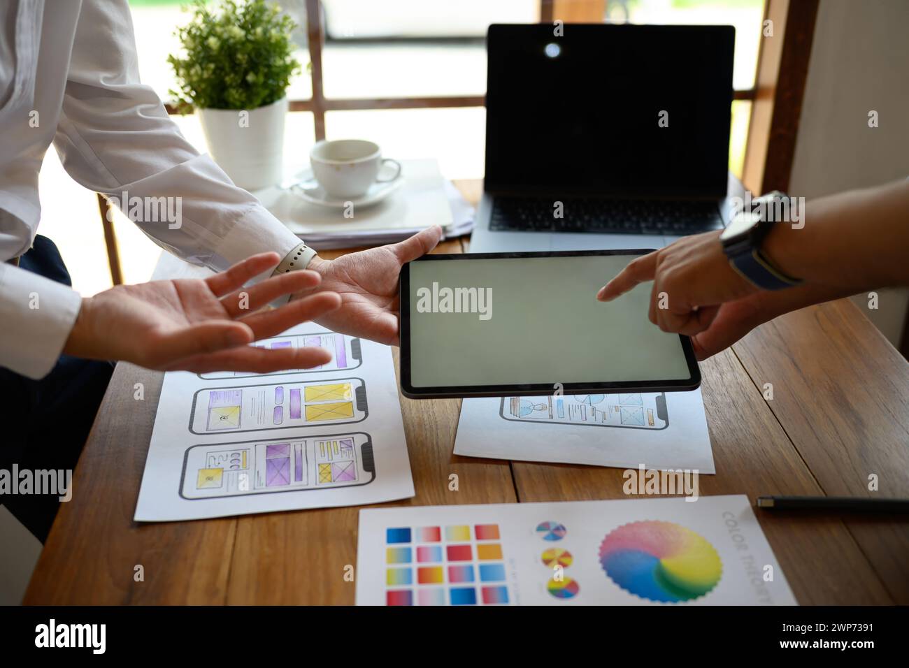 Developer Team Brainstorming For New Mobile App Interface Wireframe