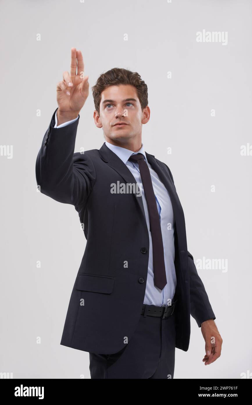 Entrepreneur, man and click a digital interface in studio on white ...