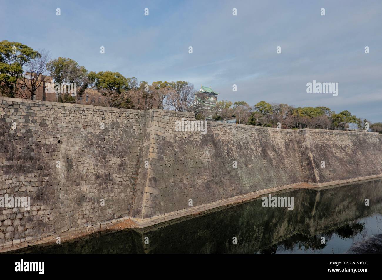Osaka Castle rises above the moat fortifications, Osaka, Japan Stock ...