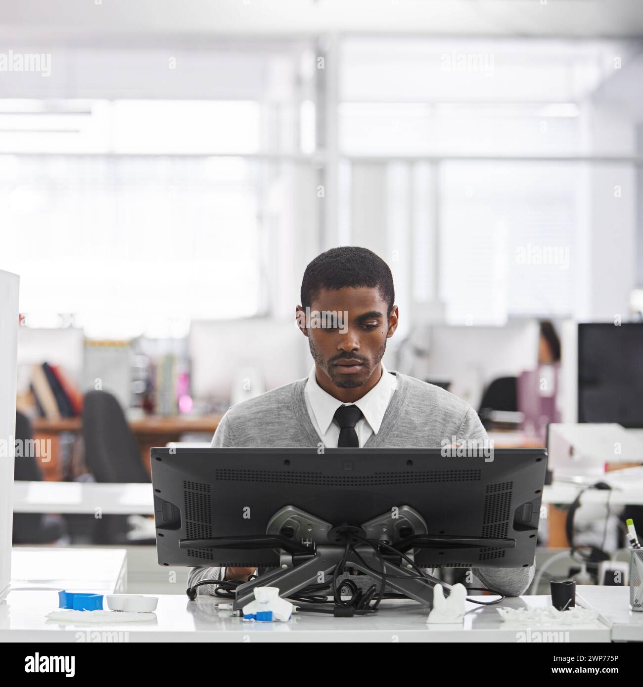 Black man, technology and worker with computer at workplace, office and ...