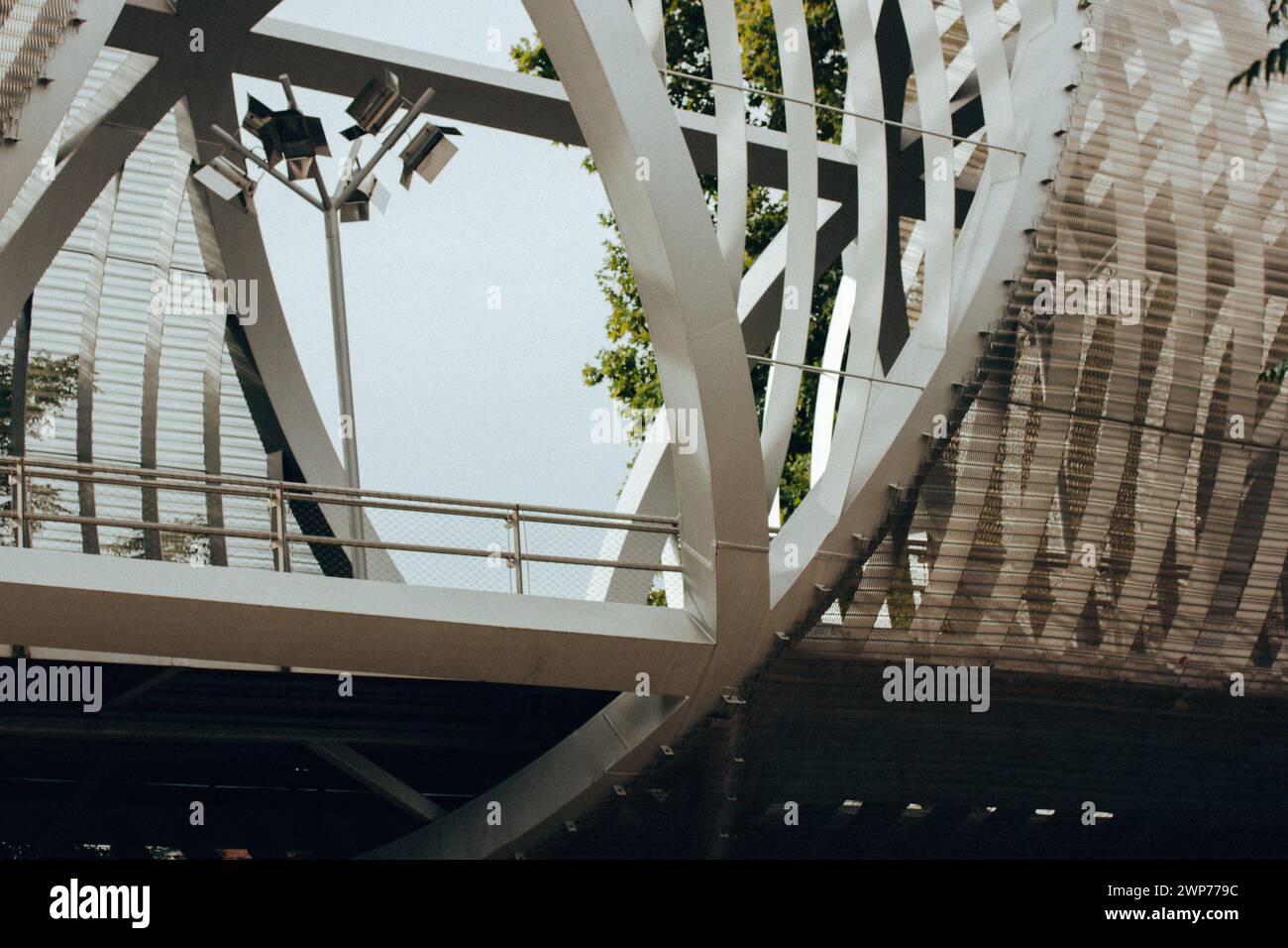 Modern overhead pedestrian tunnel metal air bridge exterior in city ...