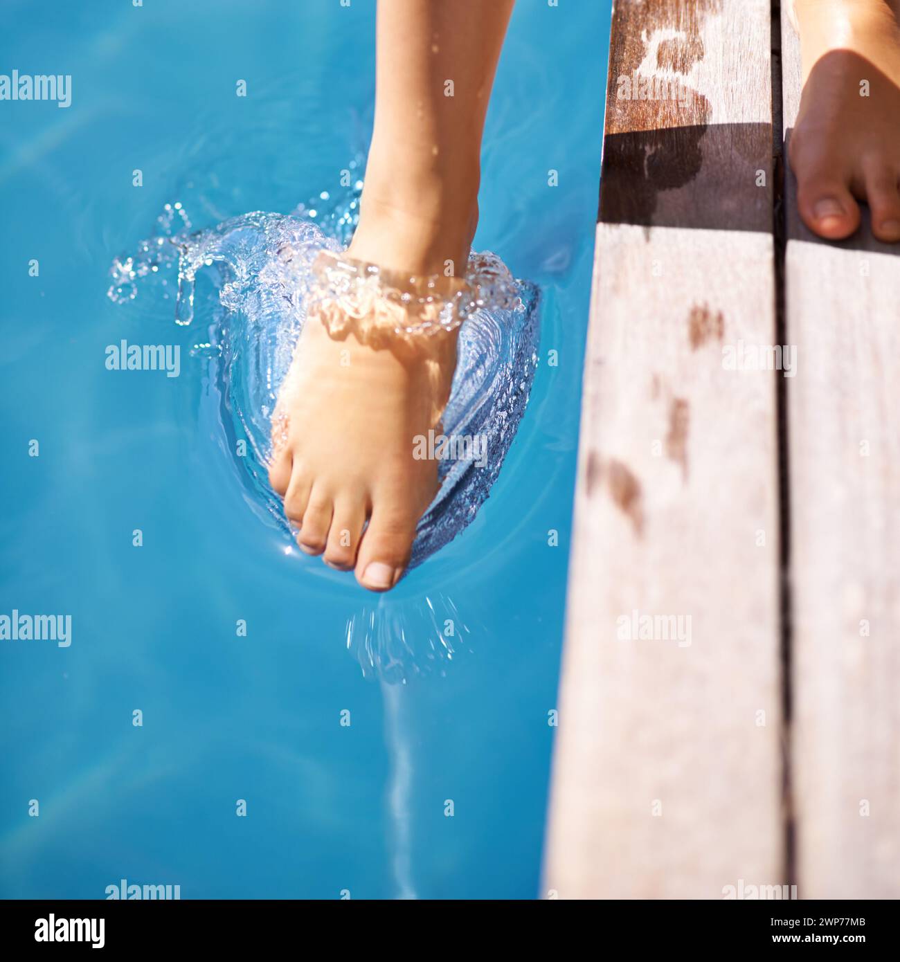 Wet, feet and pool in splash, outdoor and backyard for summer day and ...