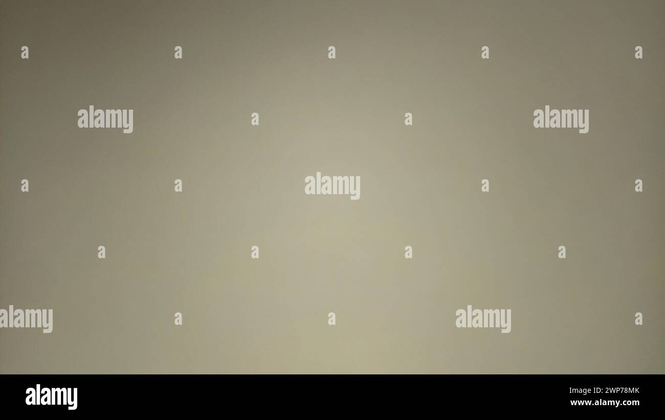 Beige background with lighting in the middle of the sheet. Paper or ...