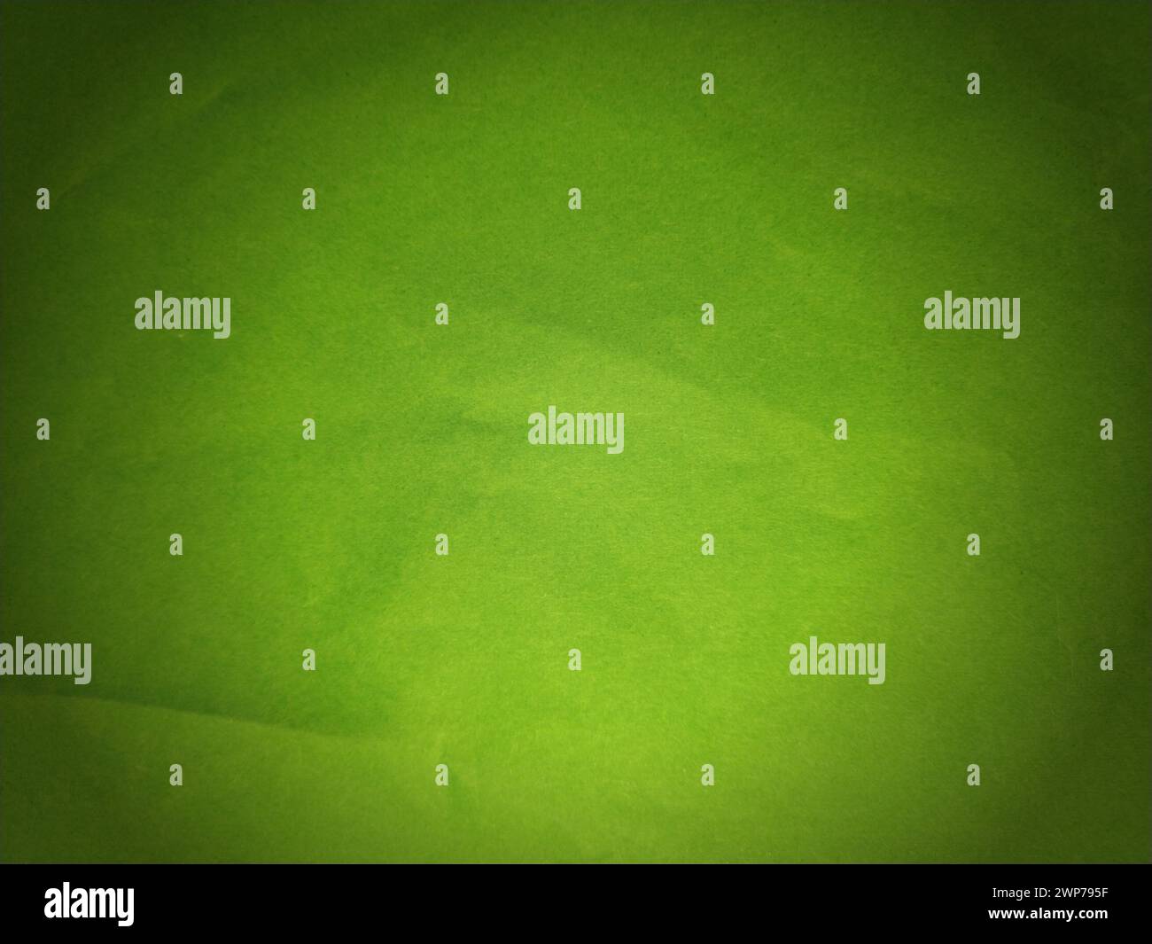 Crumpled sheet of thick green paper. Lighting on the one hand is more ...