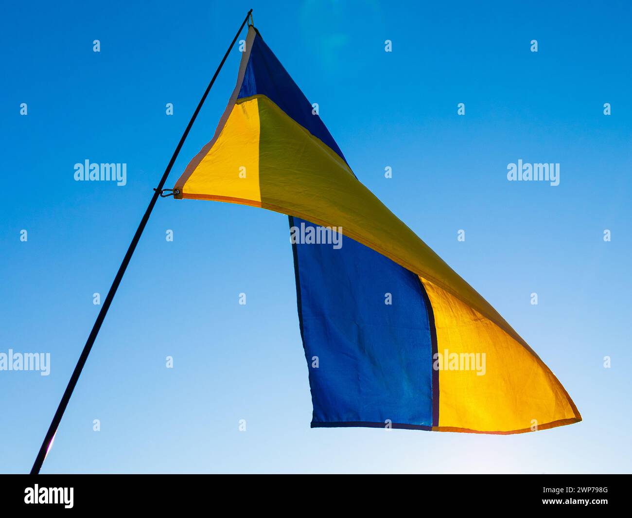 Ukrainian flag flying against the blue sky Stock Photo - Alamy