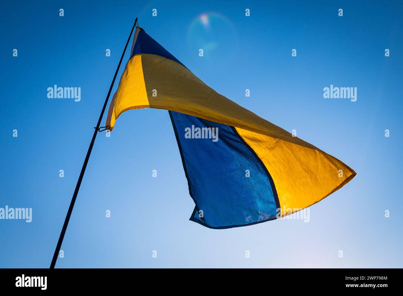 Ukrainian flag flying against the blue sky Stock Photo - Alamy