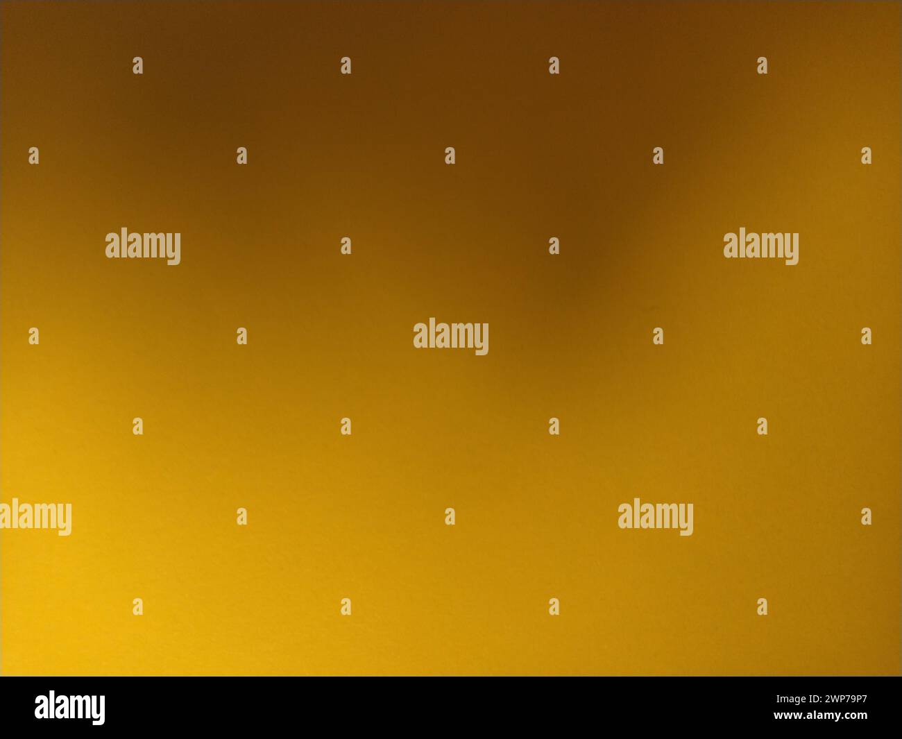 Saturated yellow paper sheet lit on one side. On the other hand, uneven ...