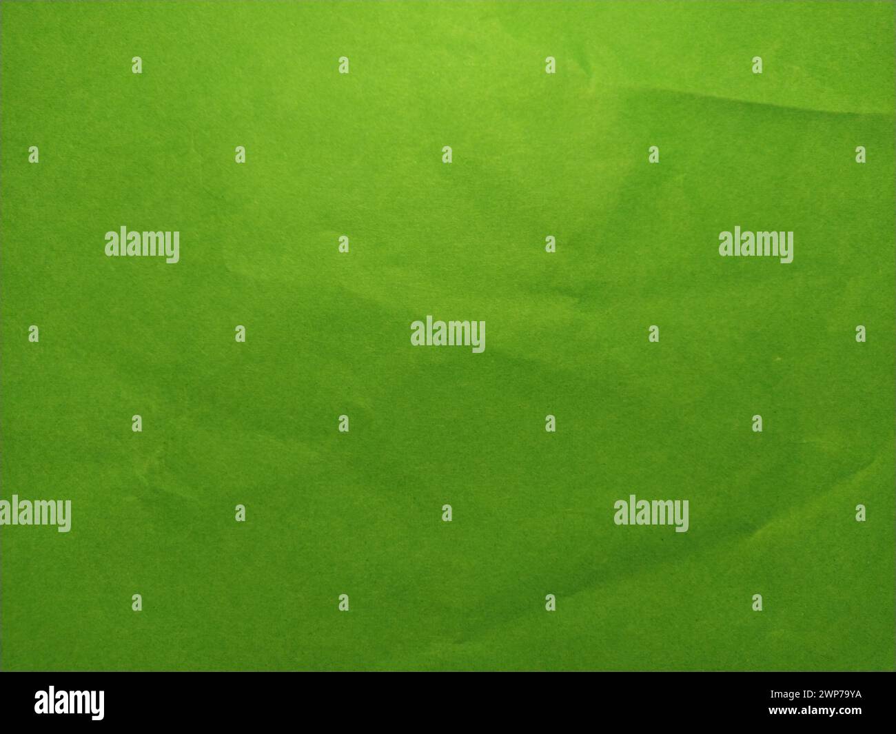 Crumpled sheet of thick green paper. Lighting on the one hand is more ...