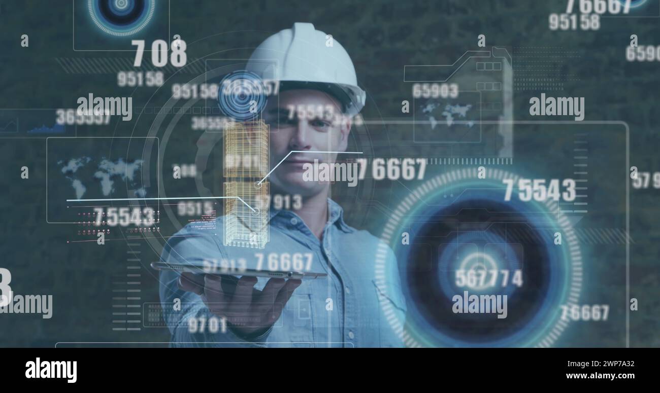 Image of numbers changing and data processing over male engineer holding tablet Stock Photo - Alamy