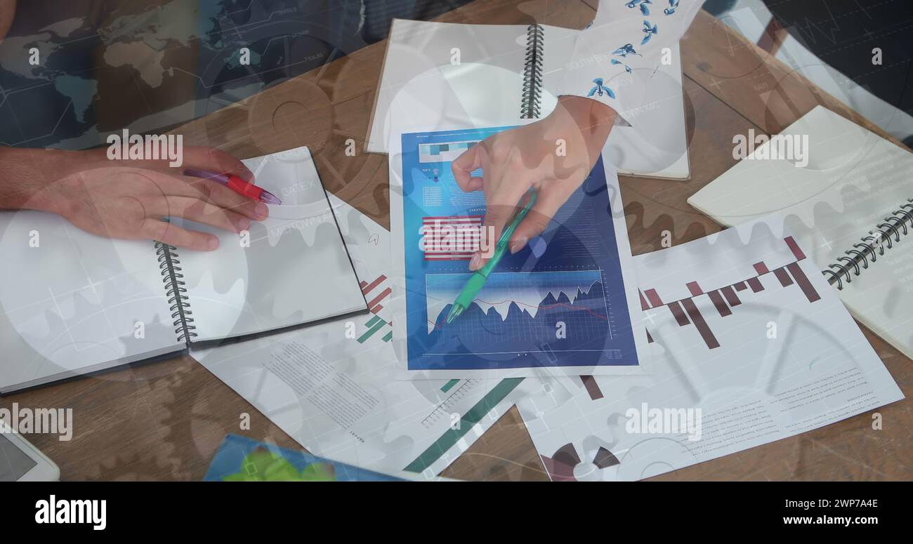 Image of data processing over diverse business people with documents ...