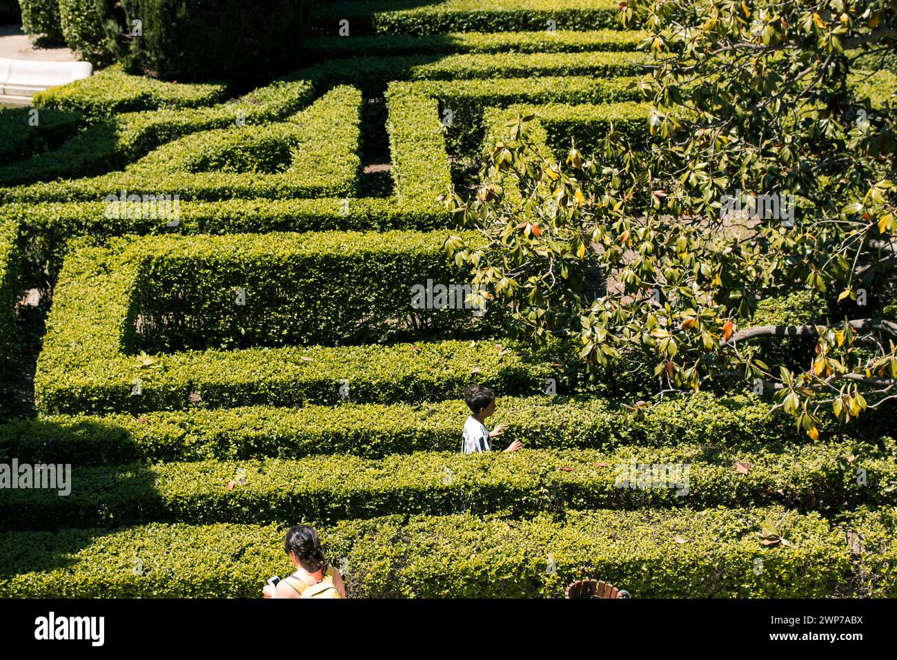 Madrid, Spain. 7 May 2023 People walking lost in a labyrinth between ...