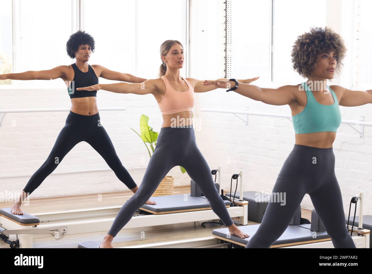 People exercising pilates reformers hi-res stock photography and images ...