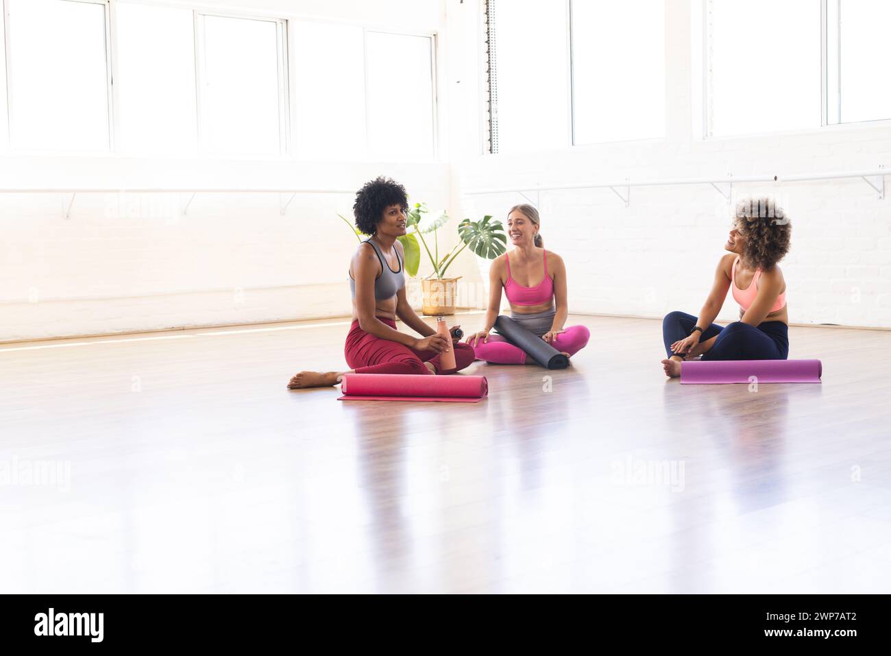 Women practice yoga in bright hi-res stock photography and images - Alamy