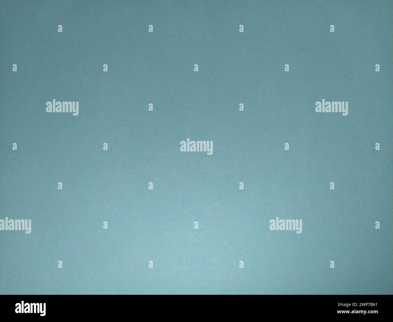 A sheet of paper or thin cardboard in blue. Lighting on the one hand ...