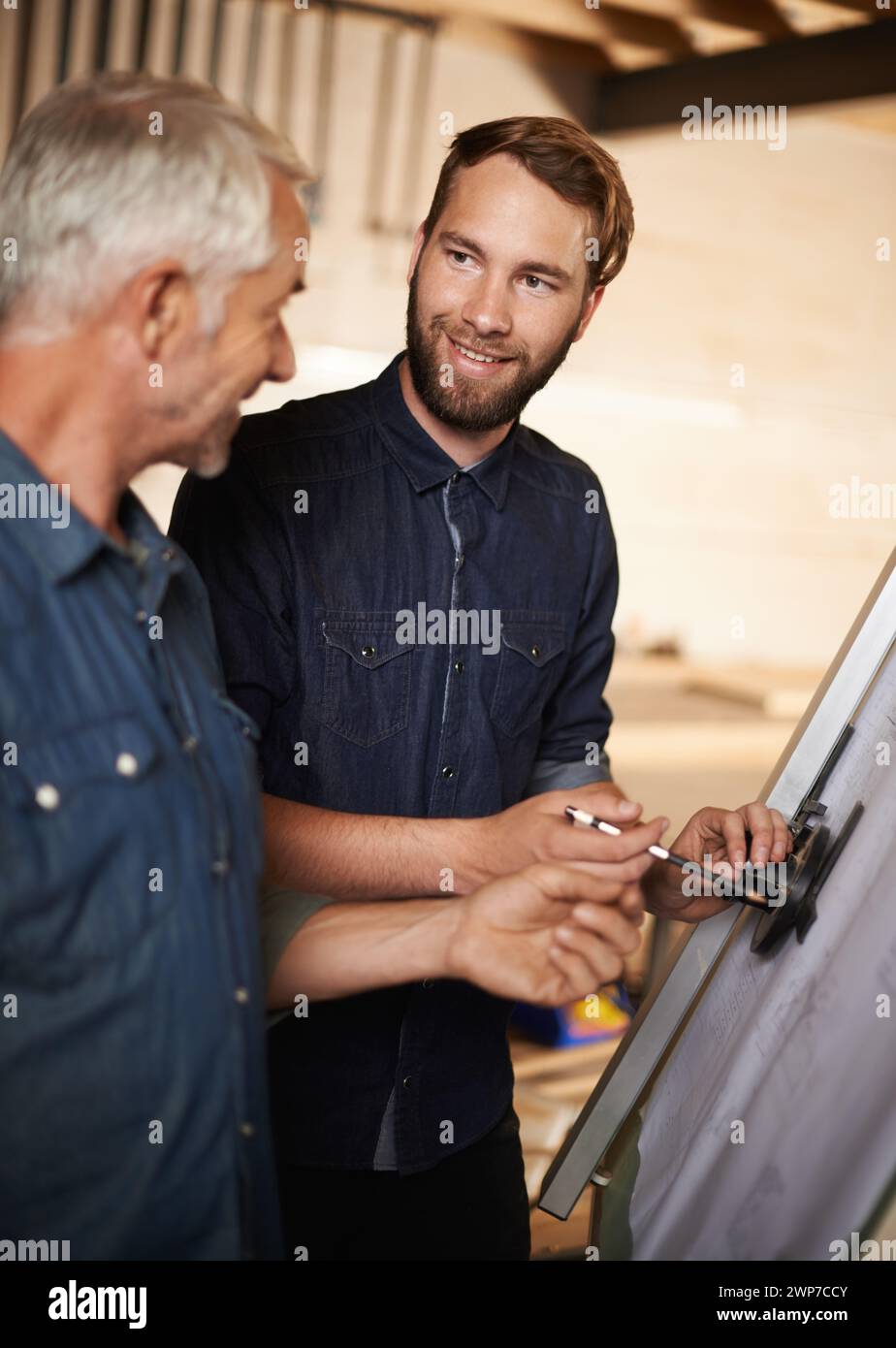 Happy father son blueprint workshop hi-res stock photography and images ...
