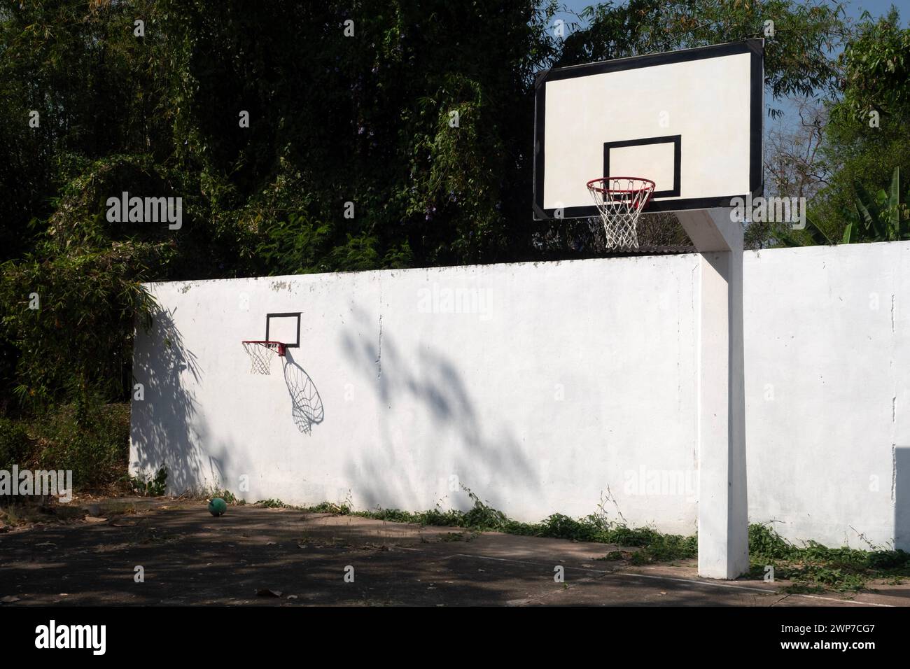 Outdoor public basketball hoop in nature background Stock Photo - Alamy