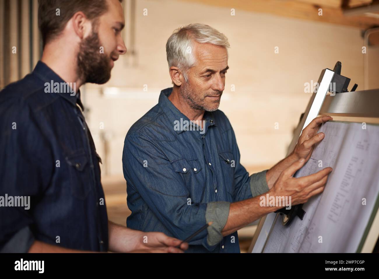 Engineer, team and men with blueprint for planning project ...