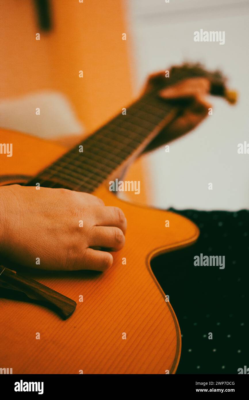 Faceless woman playing an old classical acoustic guitar. Guitarist's ...