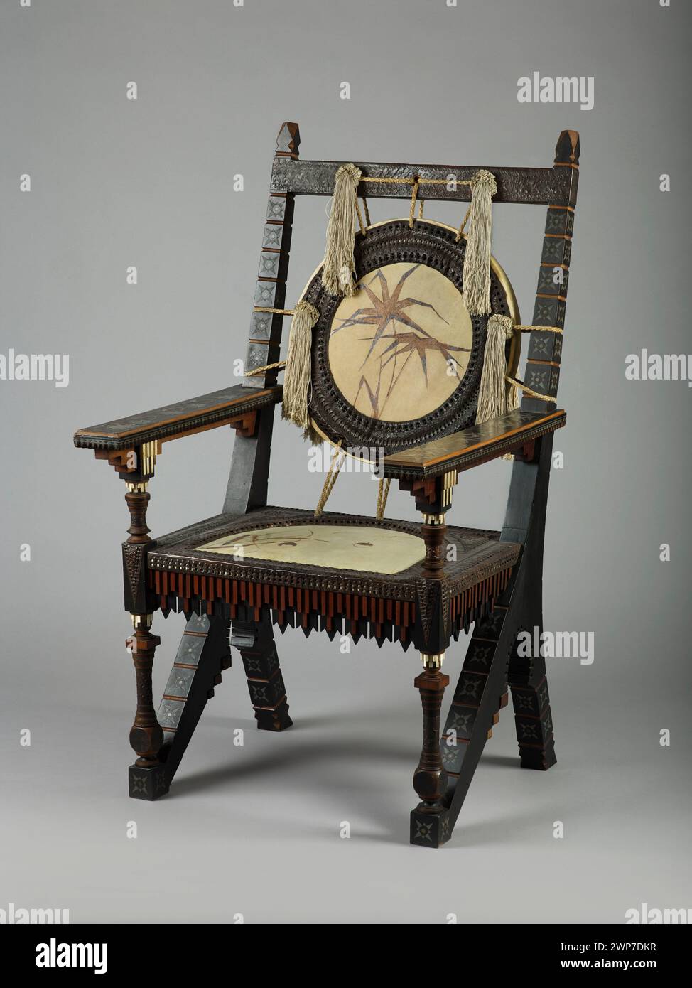 An armchair designed by Carlo Bugatti between 1895 and 1905, featuring ...
