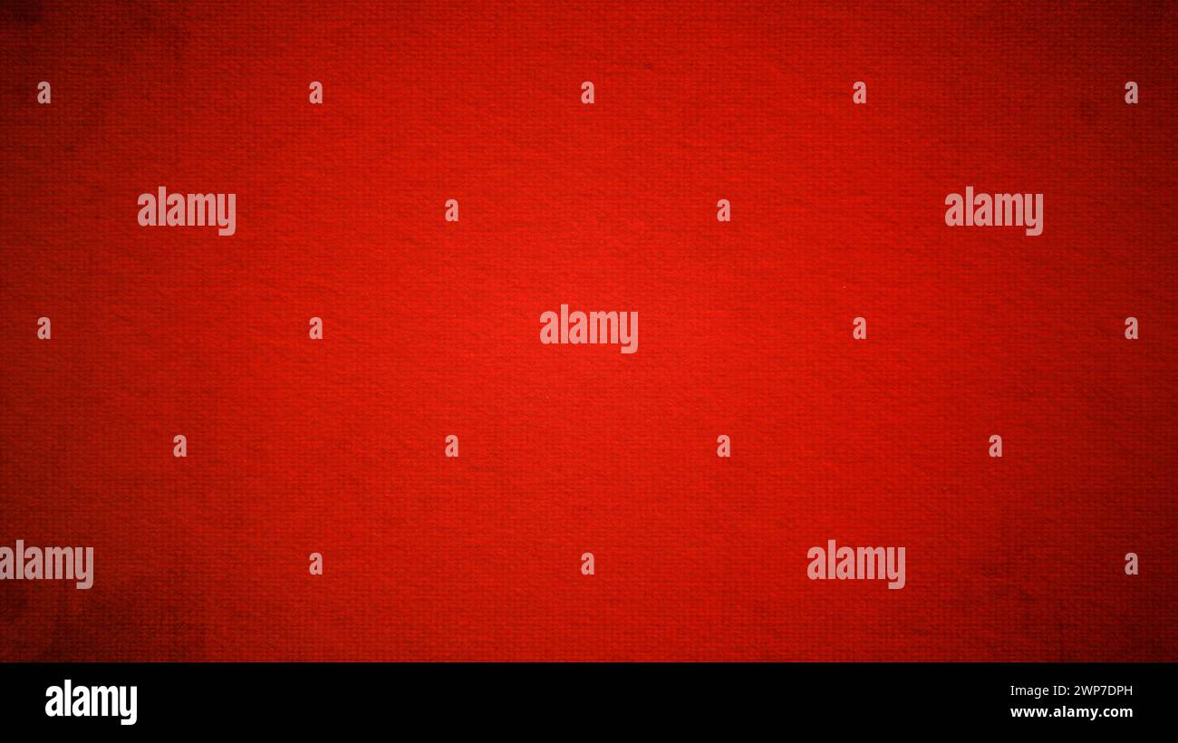A sheet of bright red paper with light vignetting around the edges ...
