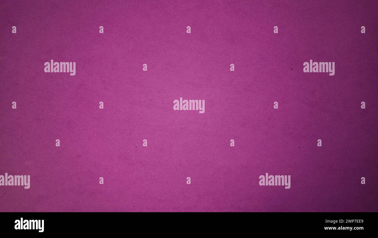 A sheet of bright purple paper with light vignetting around the edges ...