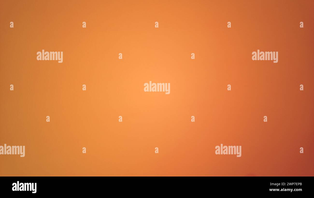 The paper is orange. Inhomogeneous lighting. In the middle of the sheet ...