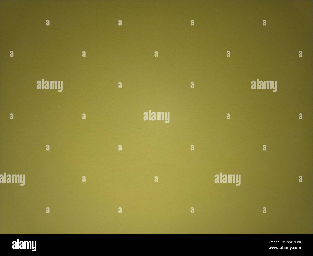 A sheet of pale yellow paper with vignetting around the edges. Dirty ...