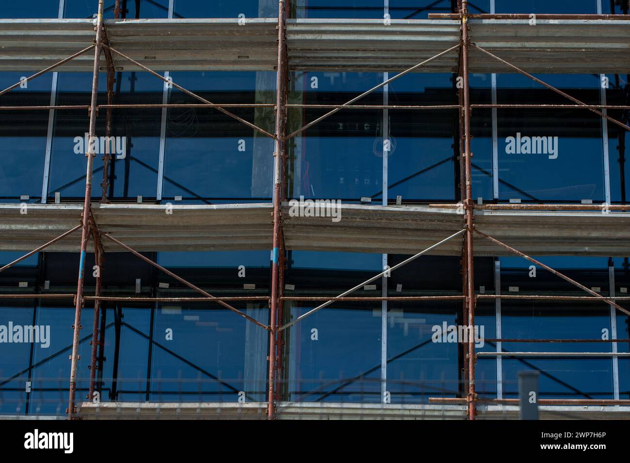 Modern Building Under Construction. Scaffolding, Glass Facade, Exterior ...