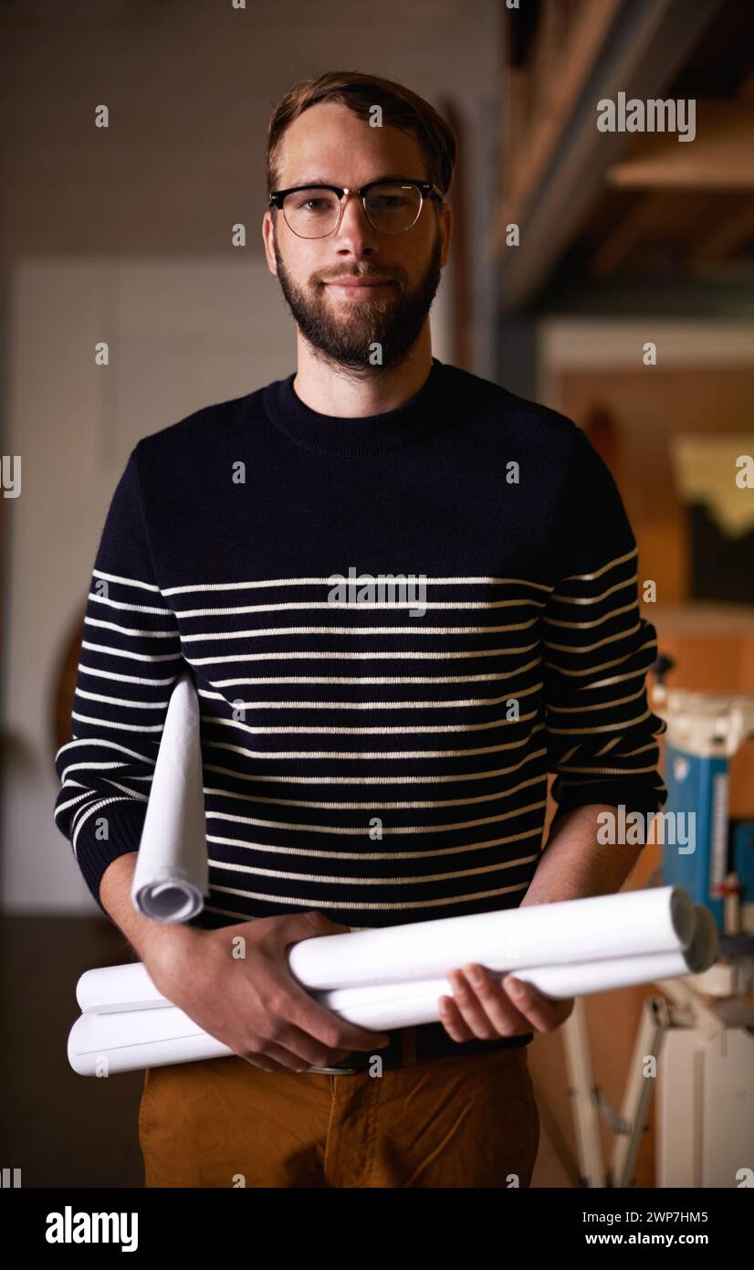 Portrait, architect and man with blueprint, engineering and real estate ...