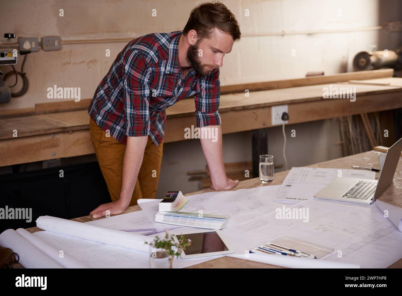 Man, check blueprint and architect with engineering or construction ...