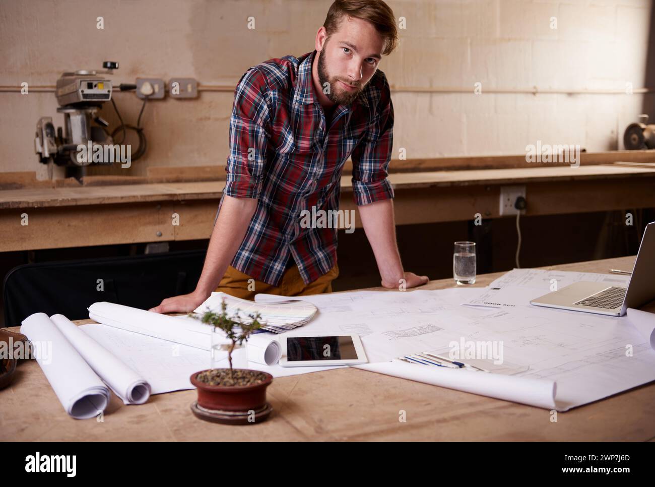 Man, portrait and architect with floor plan for engineering or ...