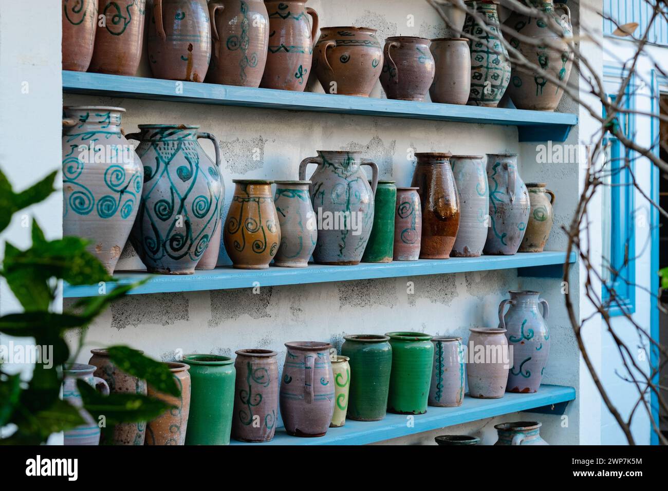 A vibrant display of handcrafted pottery, with intricate patterns ...