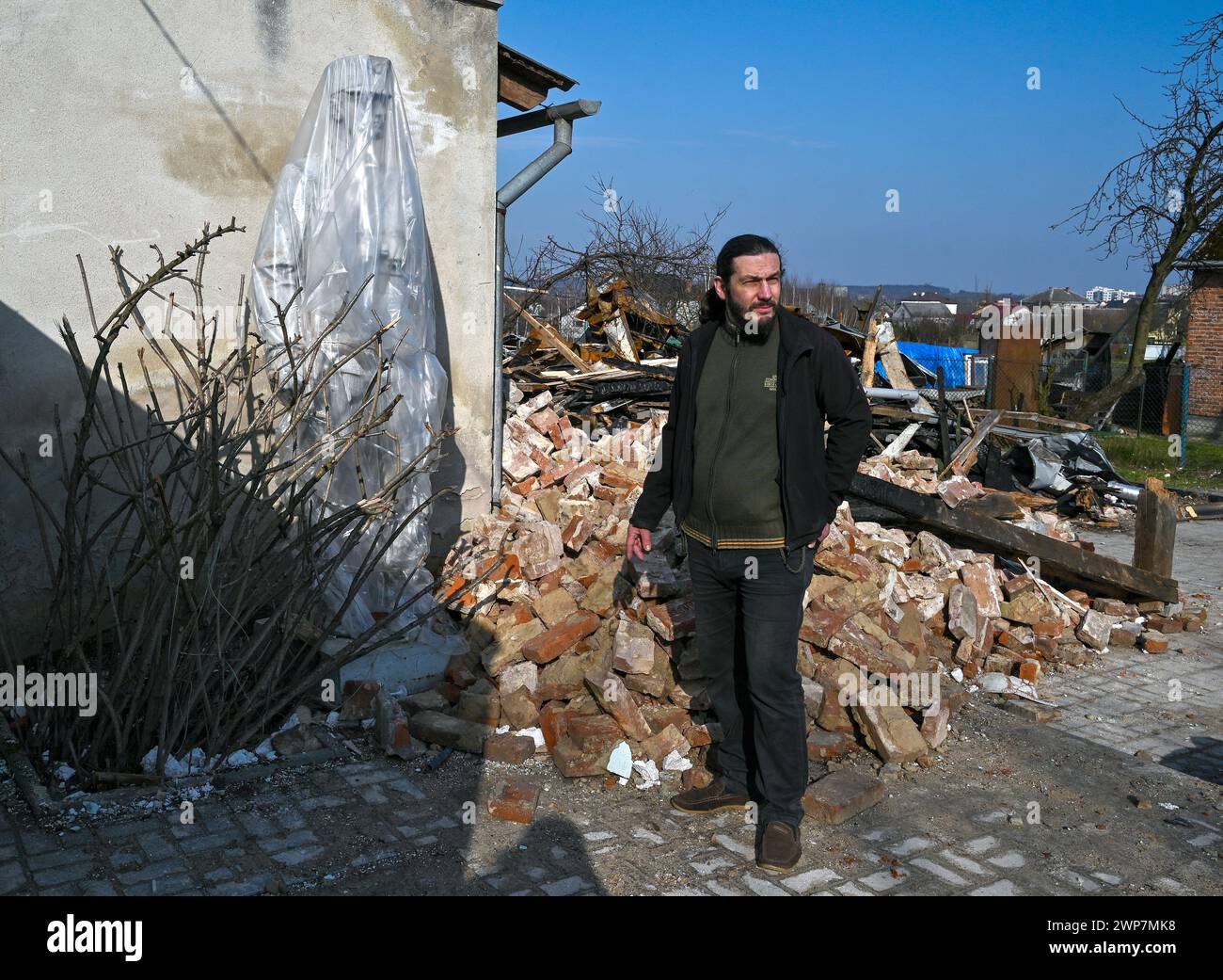 LVIV, UKRAINE - MARCH 5, 2024 - A man is seen on the ruins of the ...