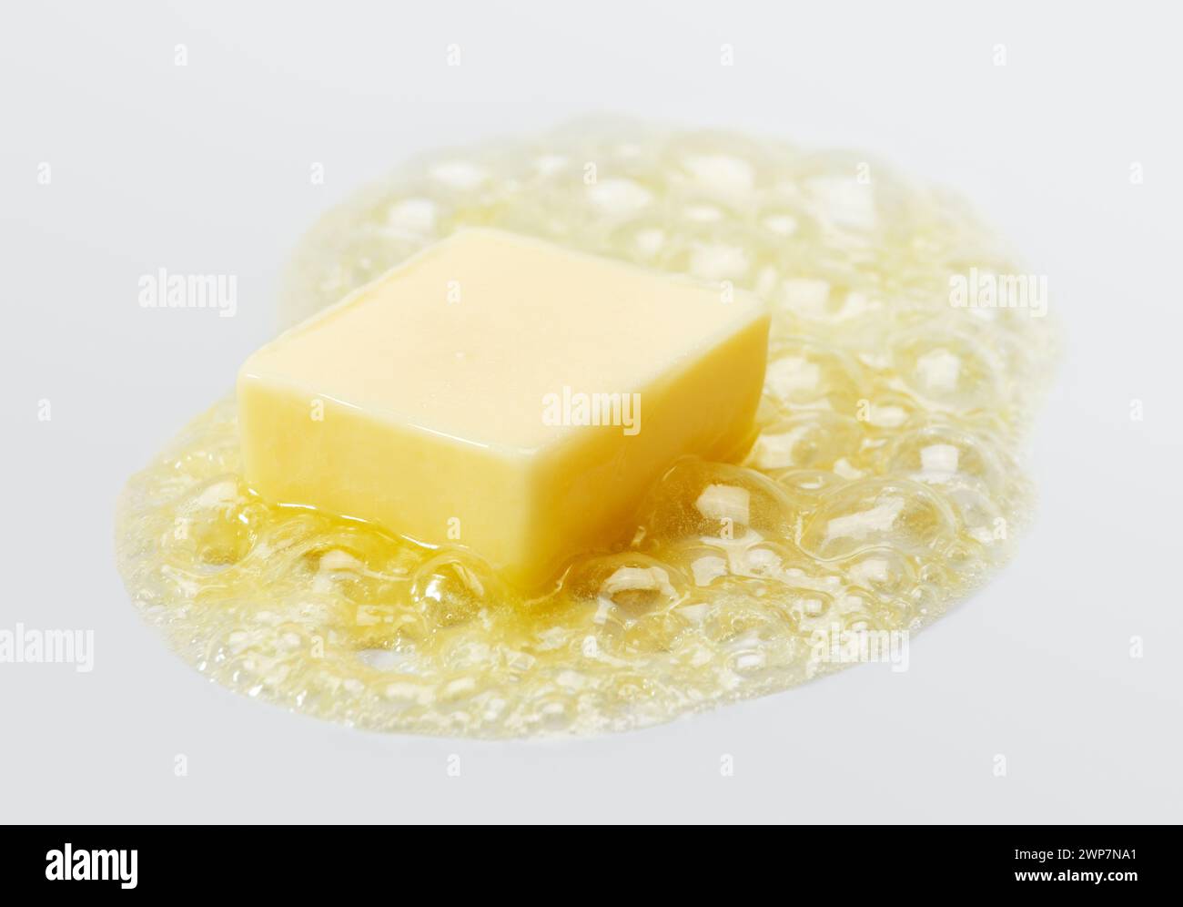 Butter melting over grey background with shallow depth of field Stock ...