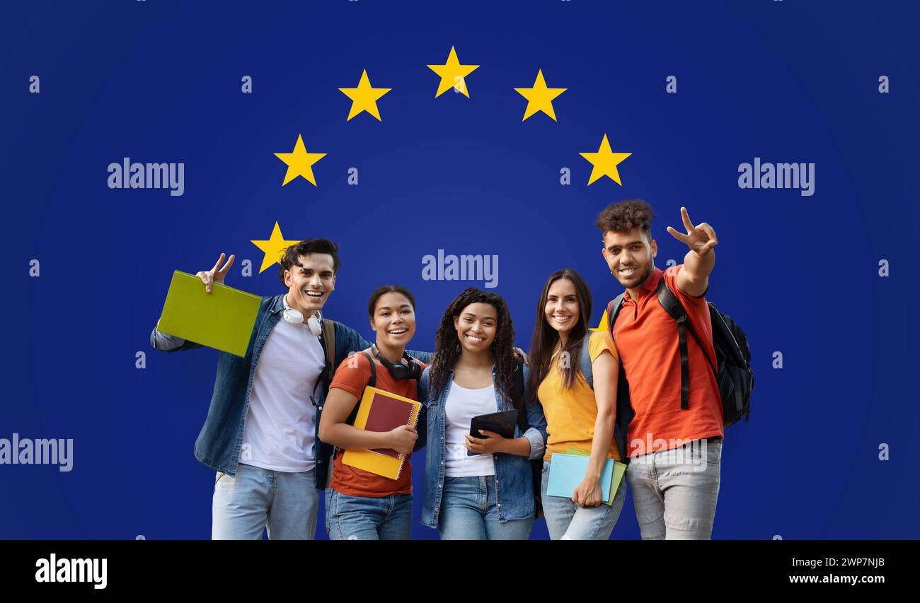 Group of five young and diverse students happily showing victory signs ...