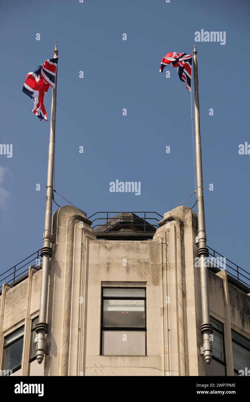 Waving union jack flags hi-res stock photography and images - Alamy