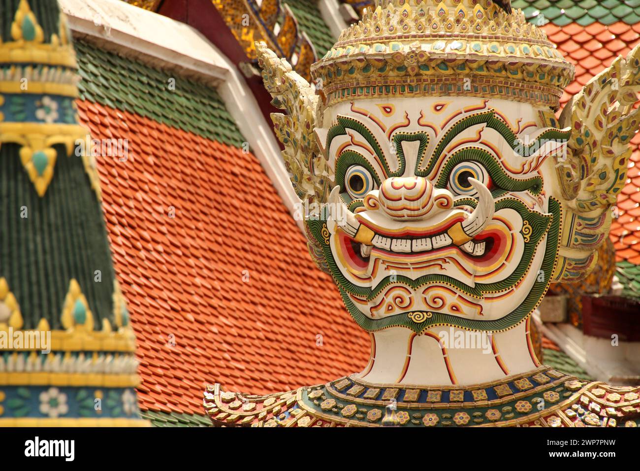 An Asian-style painted face statue with intricate design Stock Photo ...