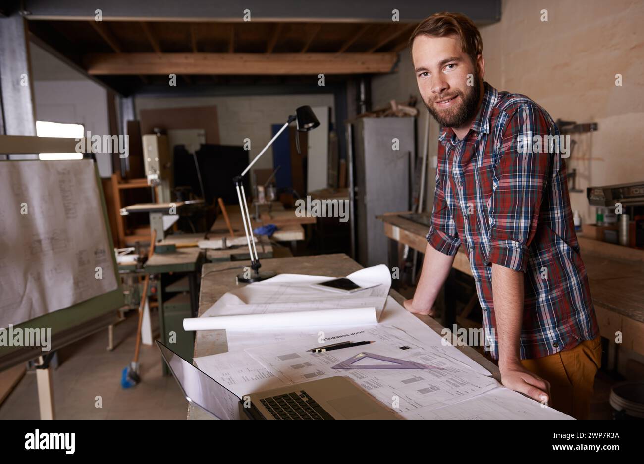 Portrait, architect and man drawing up plans, documents and blueprint ...