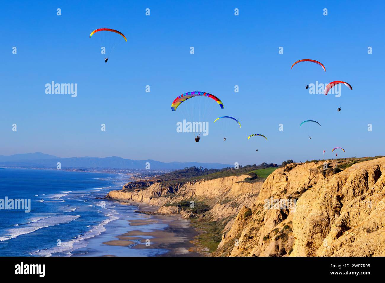 Many paragliders soaring over the cliffs, San Diego, California Stock ...
